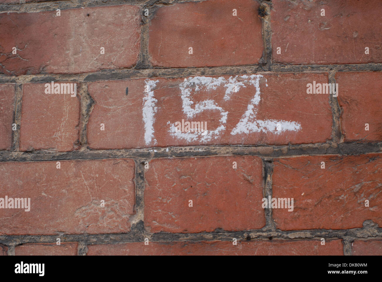 Brick wall with chalk numbers Stock Photo - Alamy