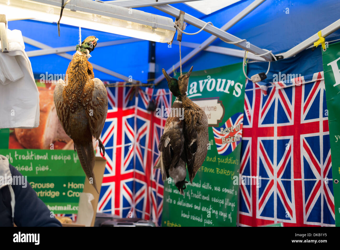 Medieval food products for sale on market stall including hedgehog pie ...