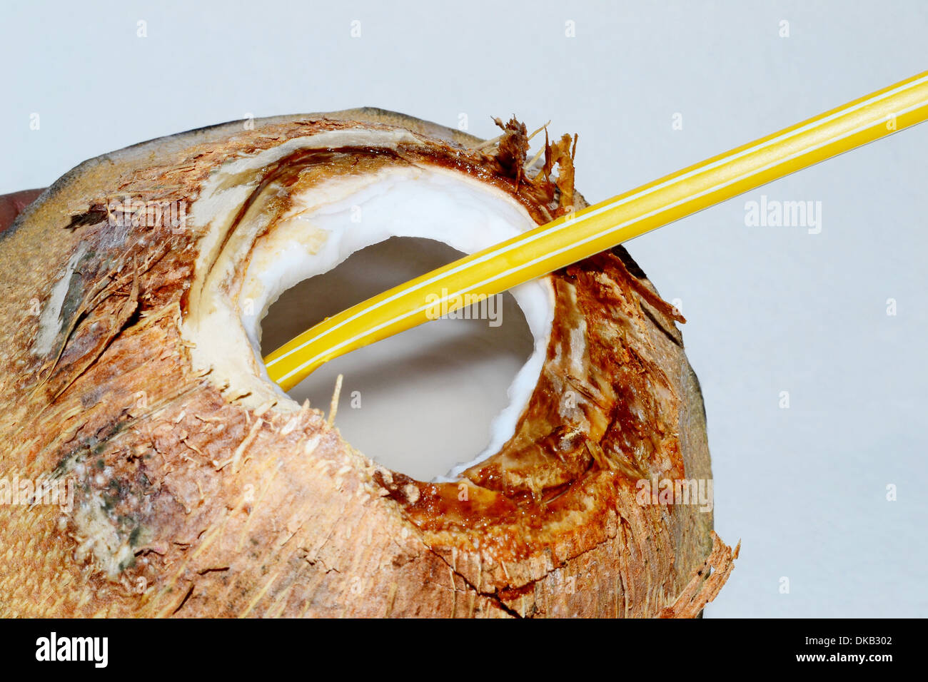 A coconut with straw, India Stock Photo - Alamy