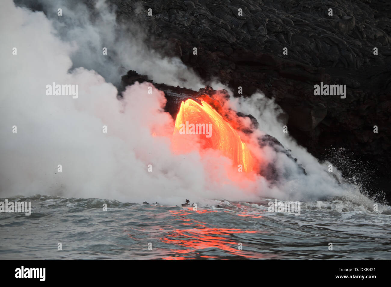 Hot lava stream is flowing into the ocean. Hawaii, Big Island Stock ...