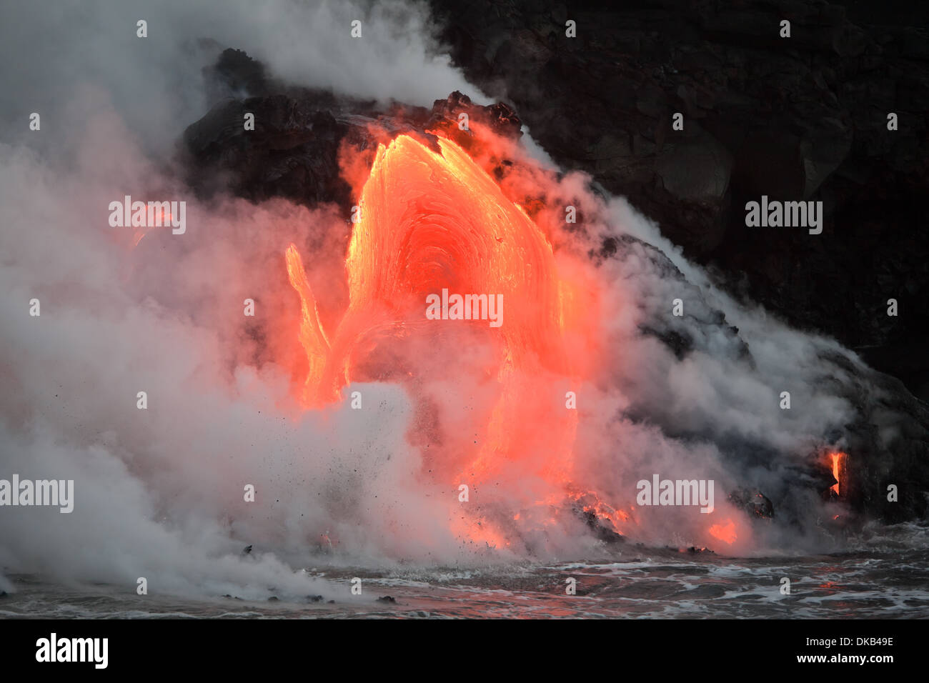 Hot lava stream is flowing into the ocean. Hawaii, Big Island Stock ...