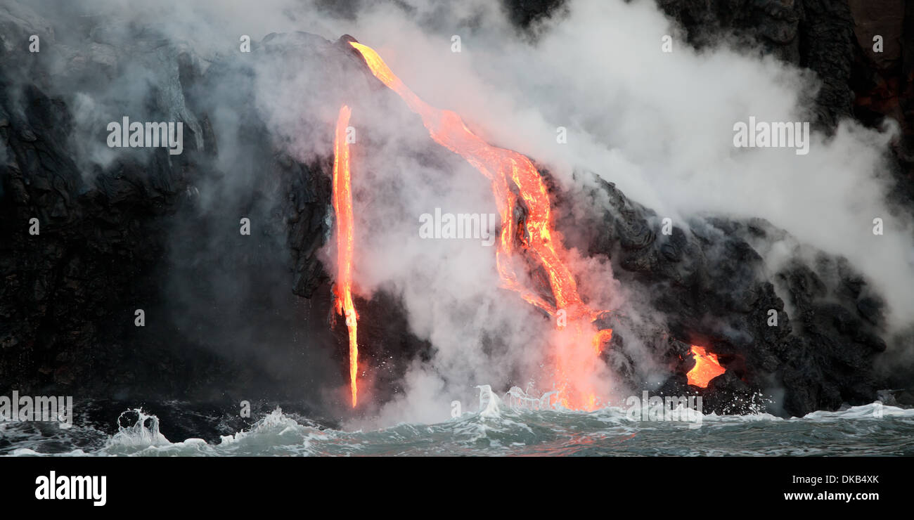 Hot lava stream is flowing into the ocean. Hawaii, Big Island Stock ...