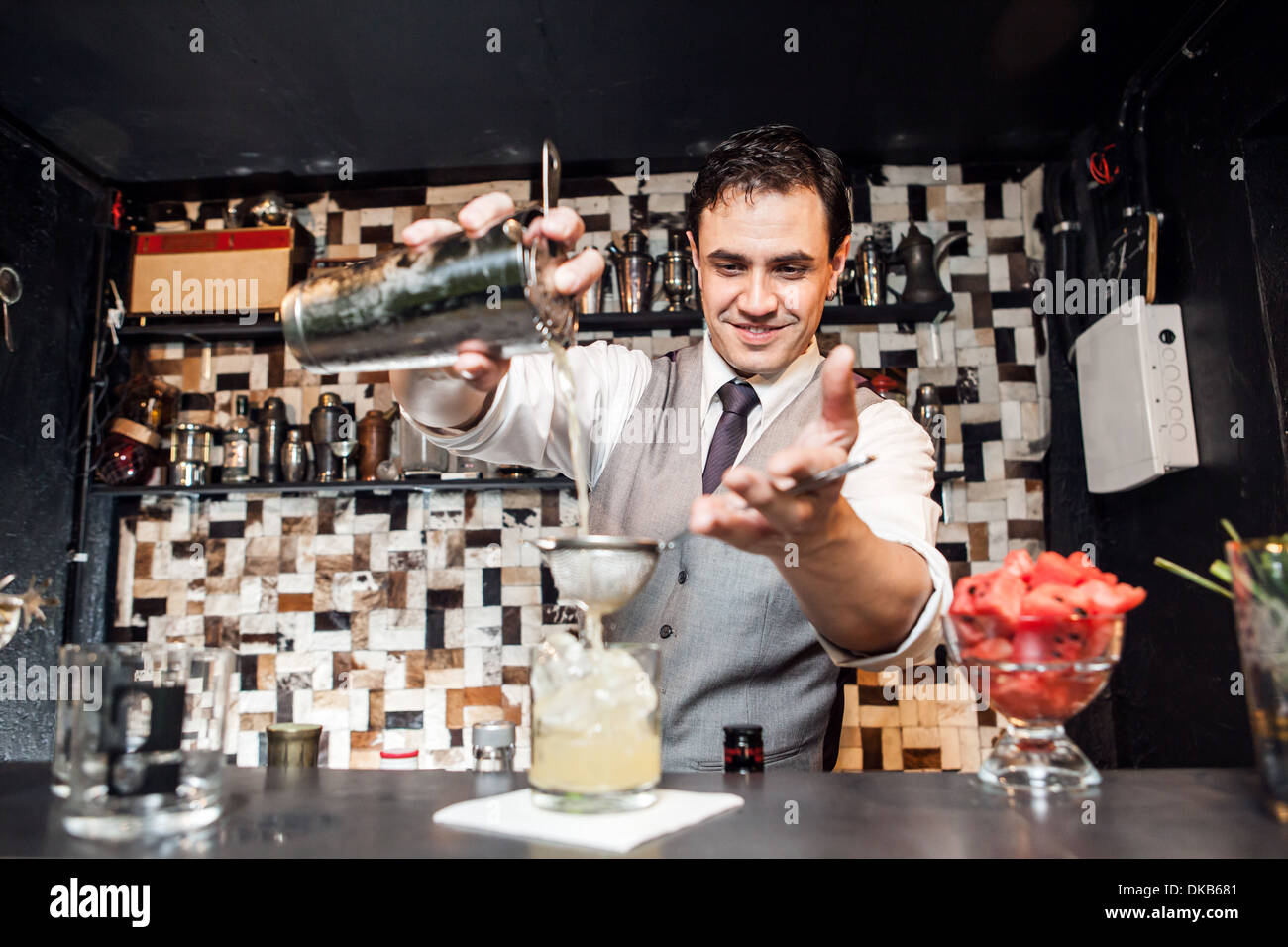Barman mixing cocktail Stock Photo - Alamy