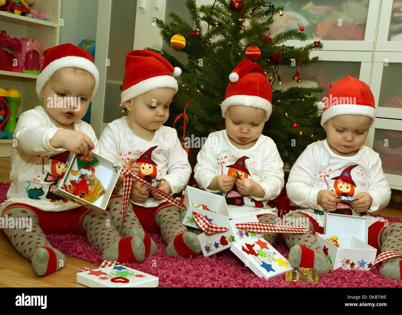 Identical quadruplets hi-res stock photography and images - Alamy