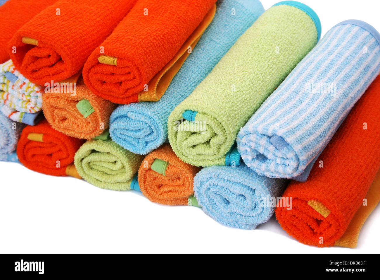 Stack of colorful towels on white background Stock Photo - Alamy