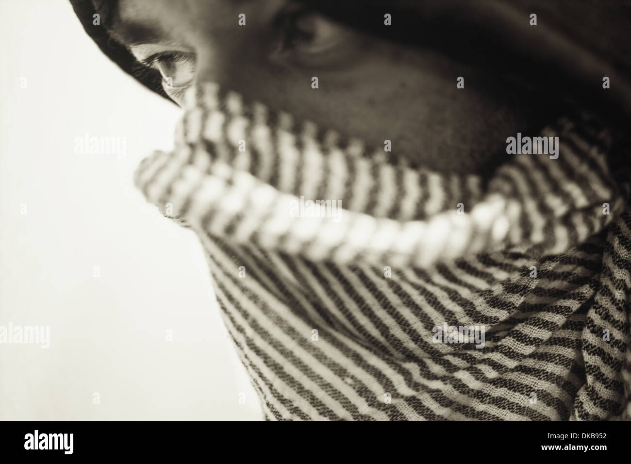 Close-up hoodie with scarf around his face Stock Photo - Alamy