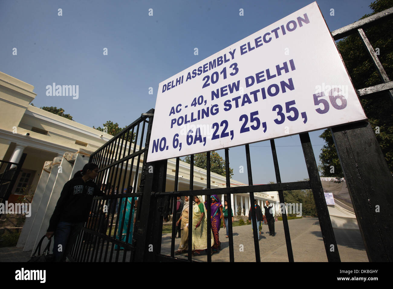 New Delhi, India . 04th Dec, 2013. Voters walk at a polling station in ...