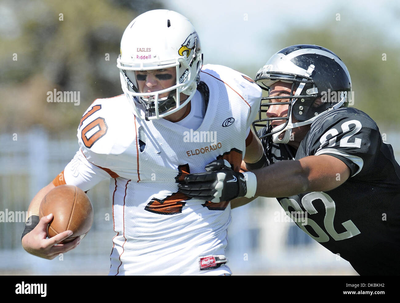 Oct. 8, 2011 - Albuquerque, NM, U.S. - Eldorado's #10 Sam Gentry tries to shake off the tackle ...