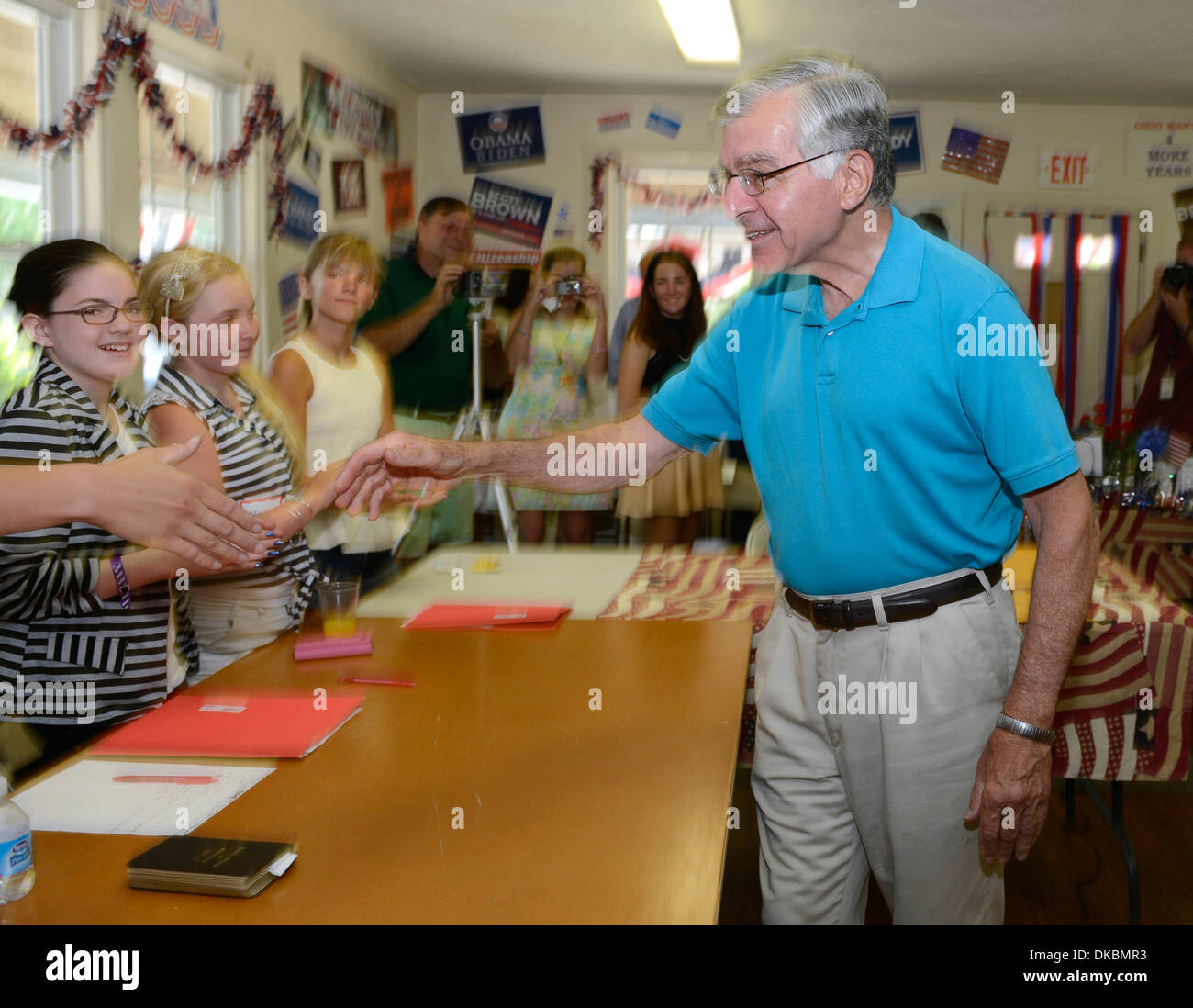 Former Mass. Governor and 1988 Presidential candidate greets camper at ...