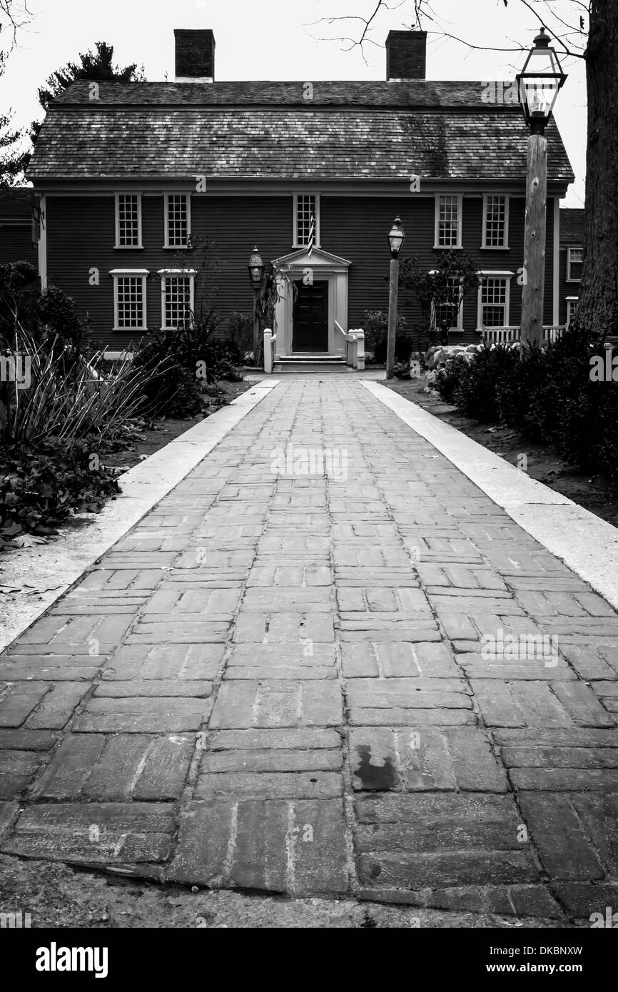 Low angle view of a brick walkway leading to the front door of a ...