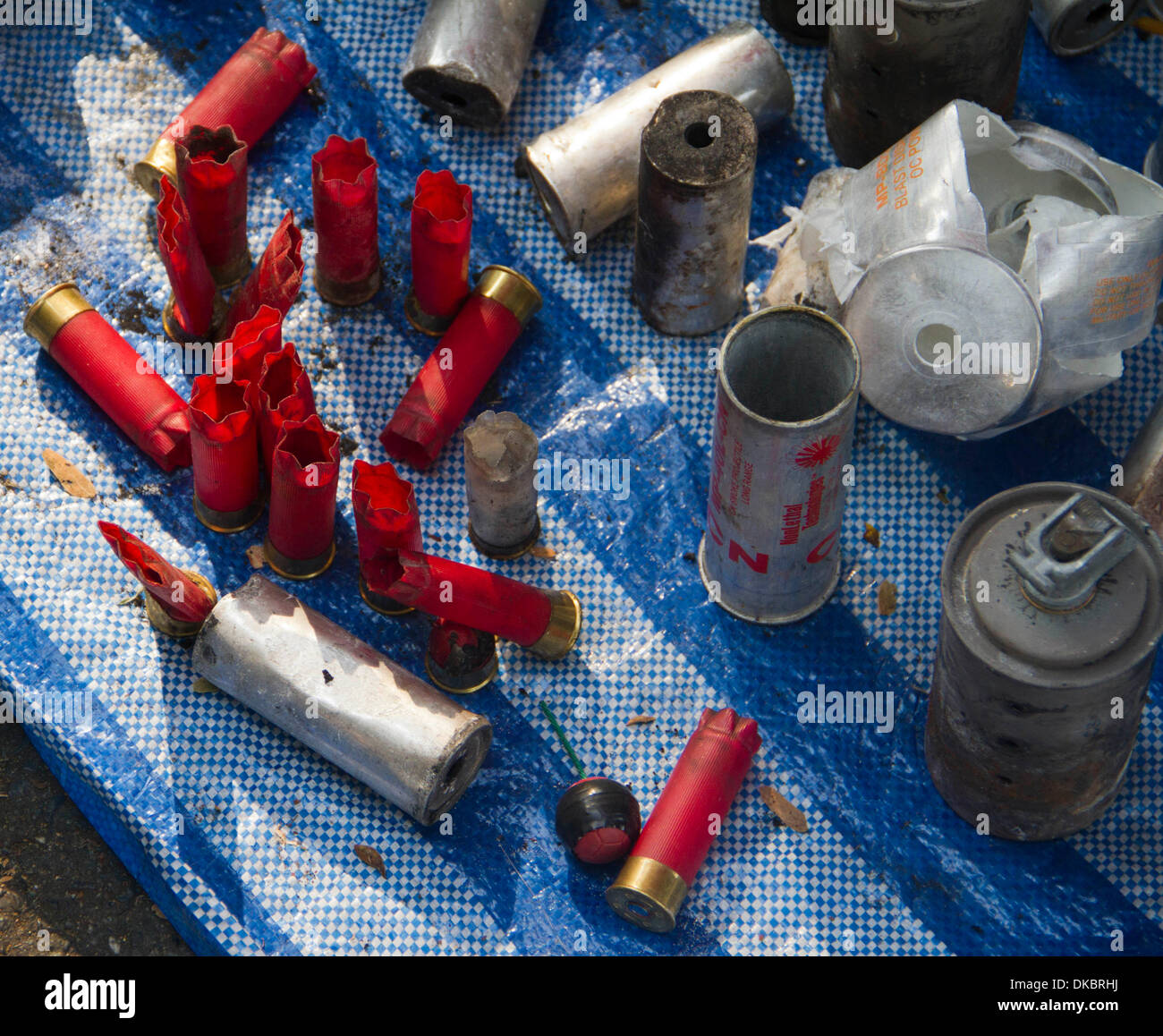 Thai anti-government protesters show collected tear gas canisters and ...