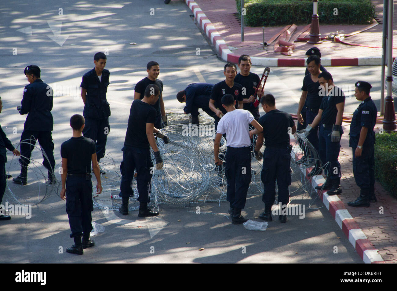 Police set up barbed wire in order to prepare defenses for a future ...