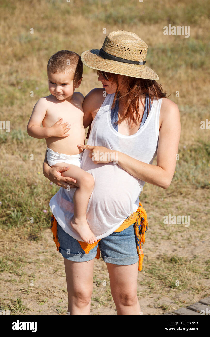Mother holding son in her arms hi-res stock photography and images - Alamy
