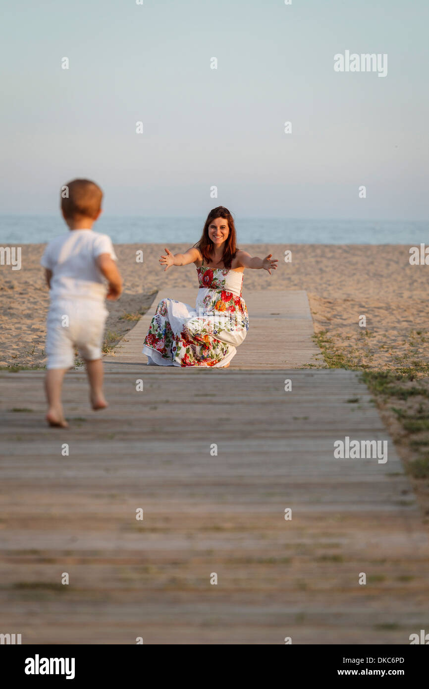 Boy running after mother hi-res stock photography and images - Alamy