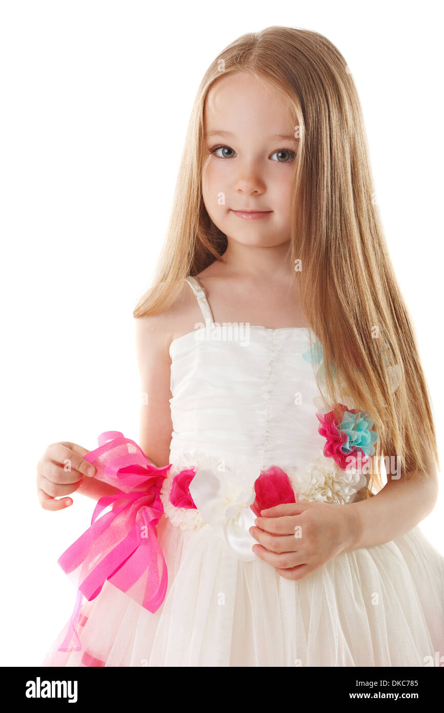 Cute little girl posing in beautiful pink dress Stock Photo - Alamy
