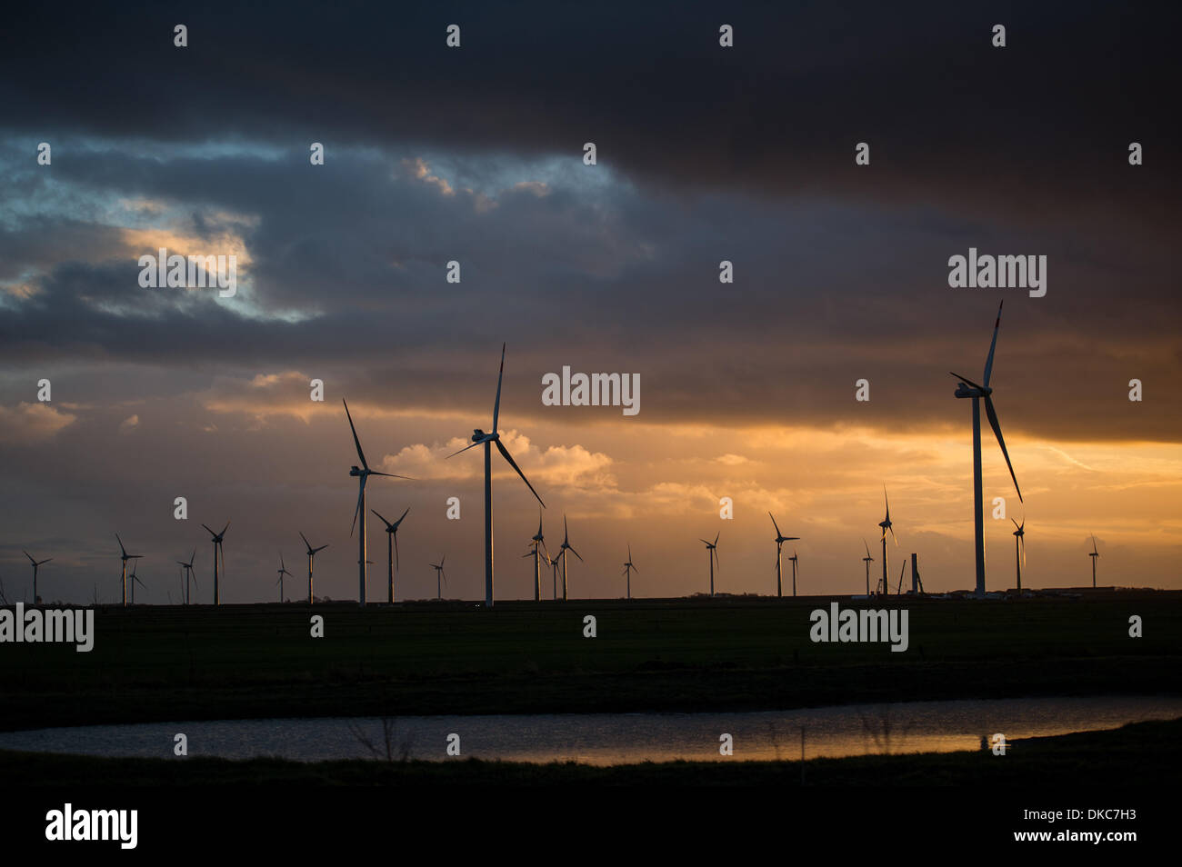 Ockholm, Germany. 04th Dec, 2013. Wind turbines turn during sunset in ...