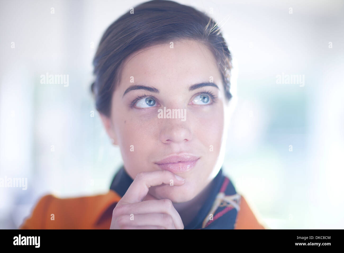 Businesswoman with hand on chin hi-res stock photography and images - Alamy