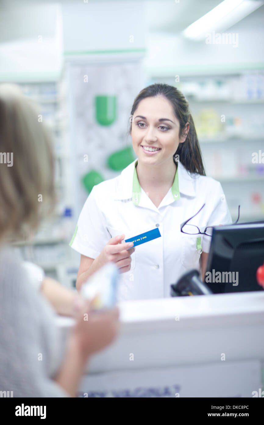 Female shop assistant till hi-res stock photography and images - Alamy