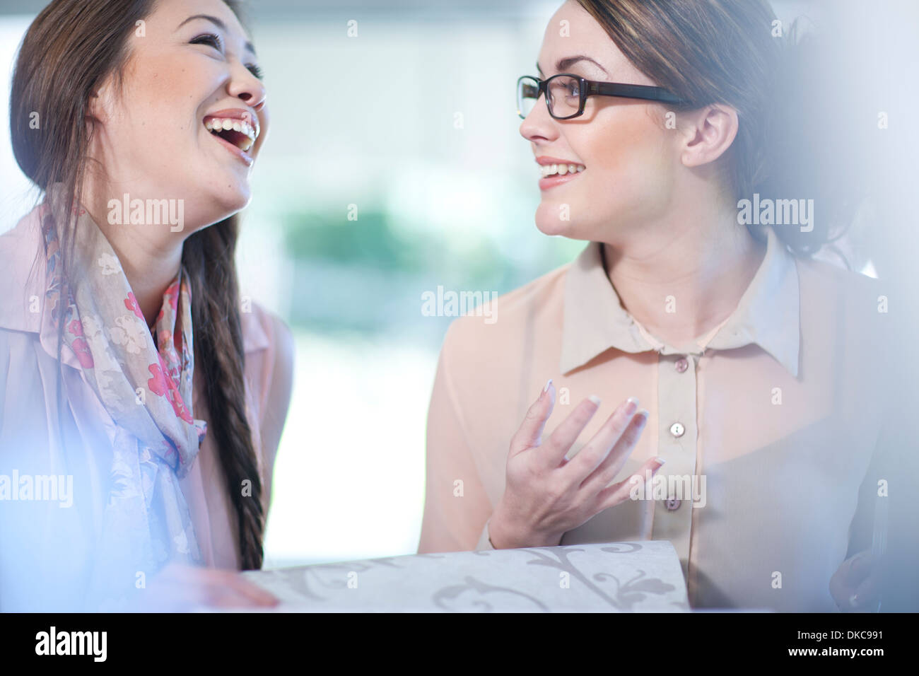 Interior designer and client with wallpaper book Stock Photo - Alamy