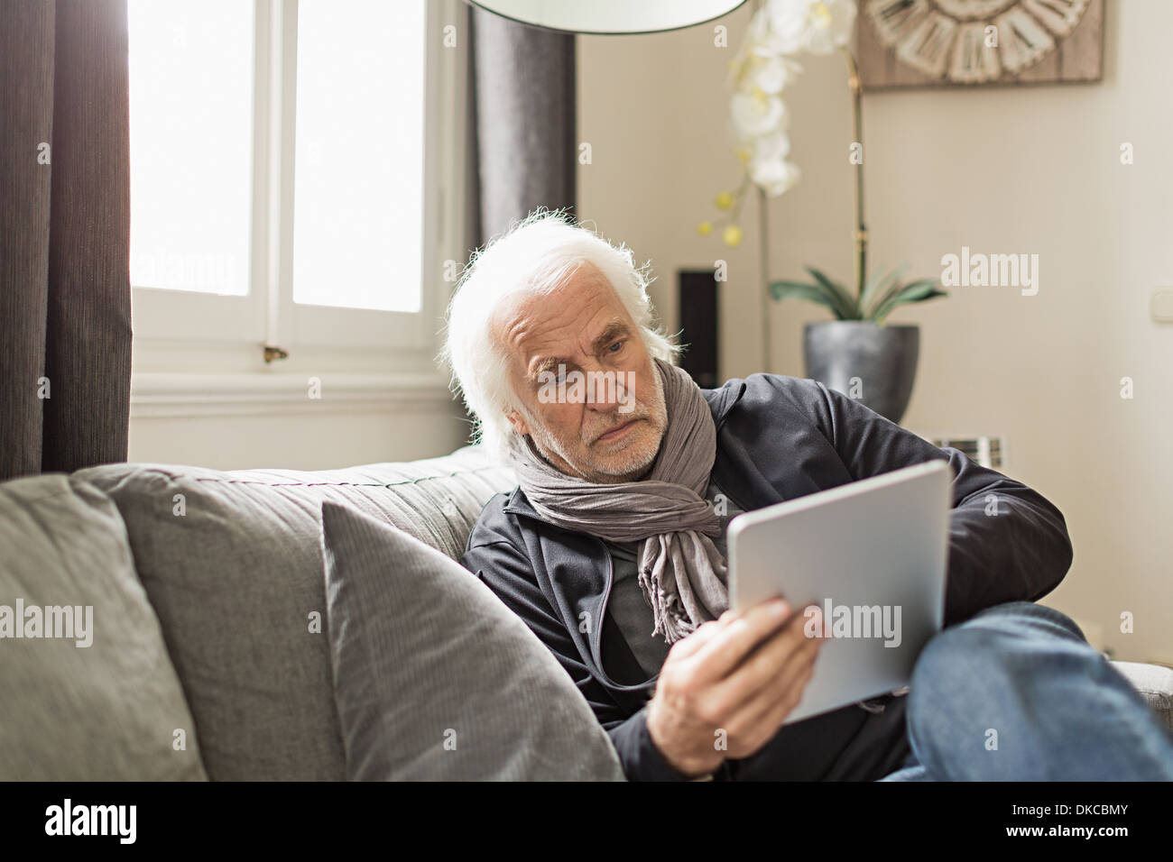 Senior man using digital tablet Stock Photo - Alamy