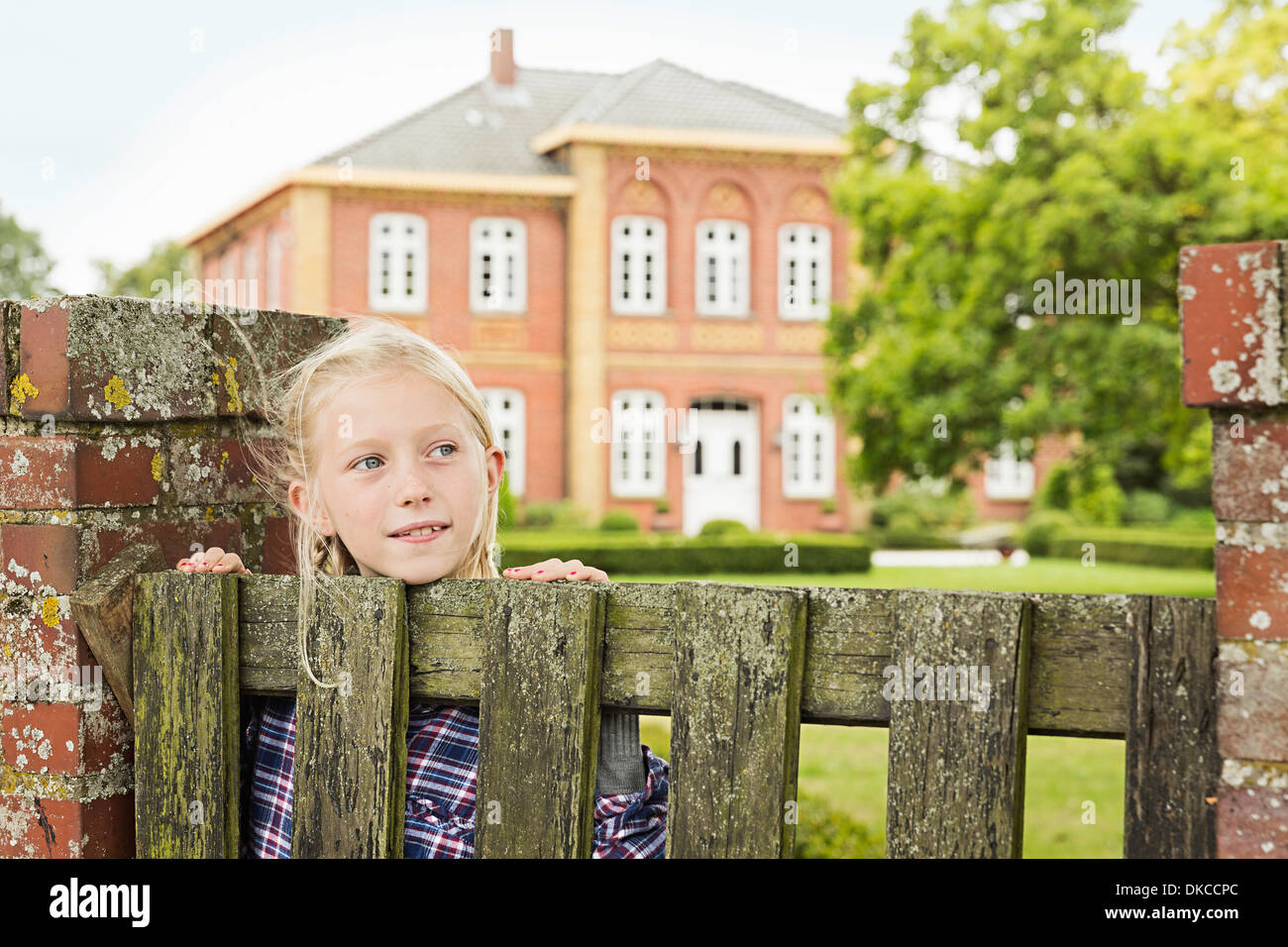 Girl by wooden gate hi-res stock photography and images - Alamy