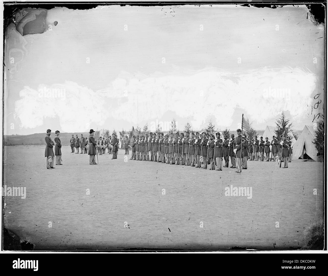 An infantry company is pictured at parade rest, likely during a ...