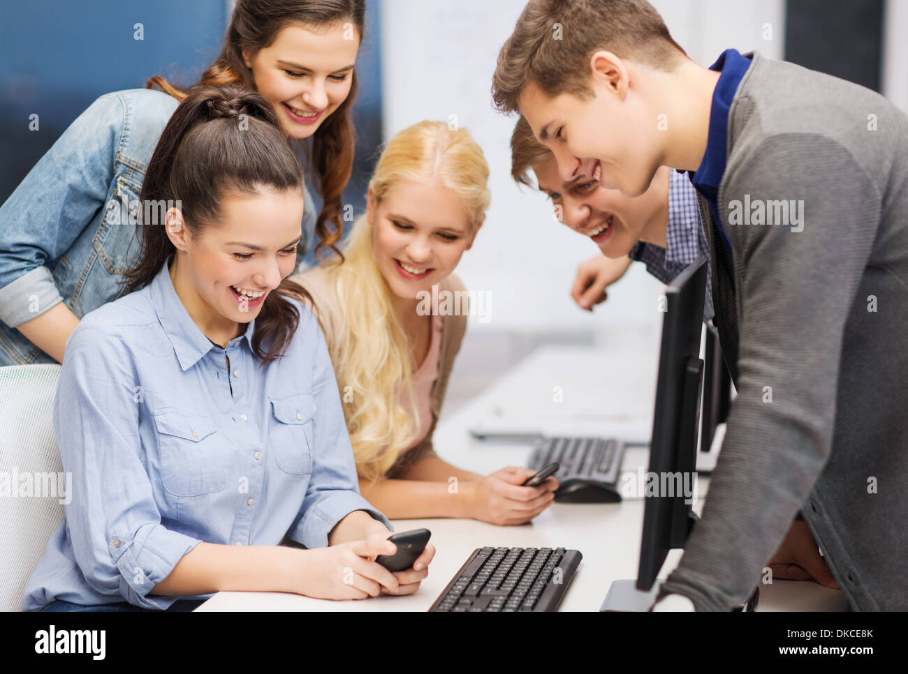 students with computer monitor and smartphones Stock Photo - Alamy