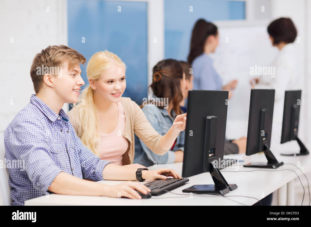 students with computer monitor at school Stock Photo - Alamy
