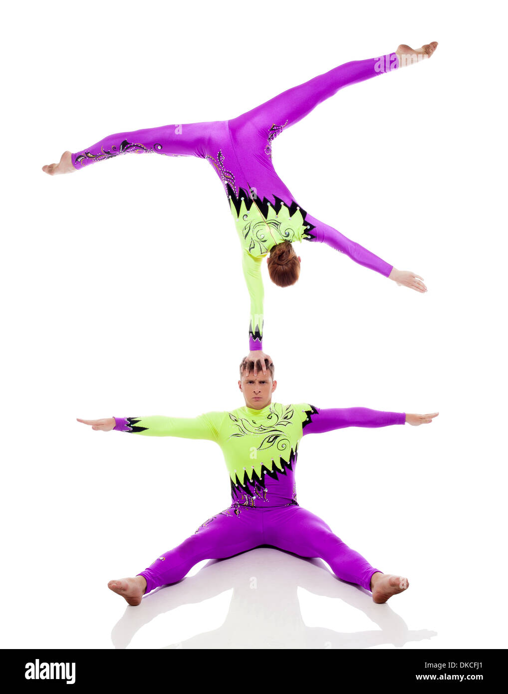 Focused acrobats balancing, isolated on white Stock Photo - Alamy