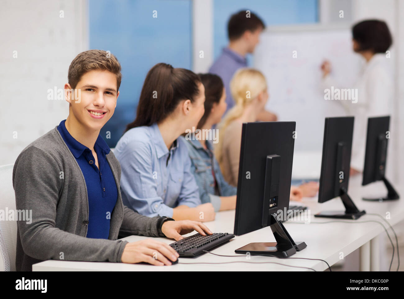 students with computer monitor at school Stock Photo - Alamy