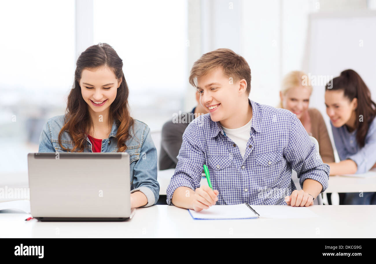 students with laptop and notebooks at school Stock Photo - Alamy