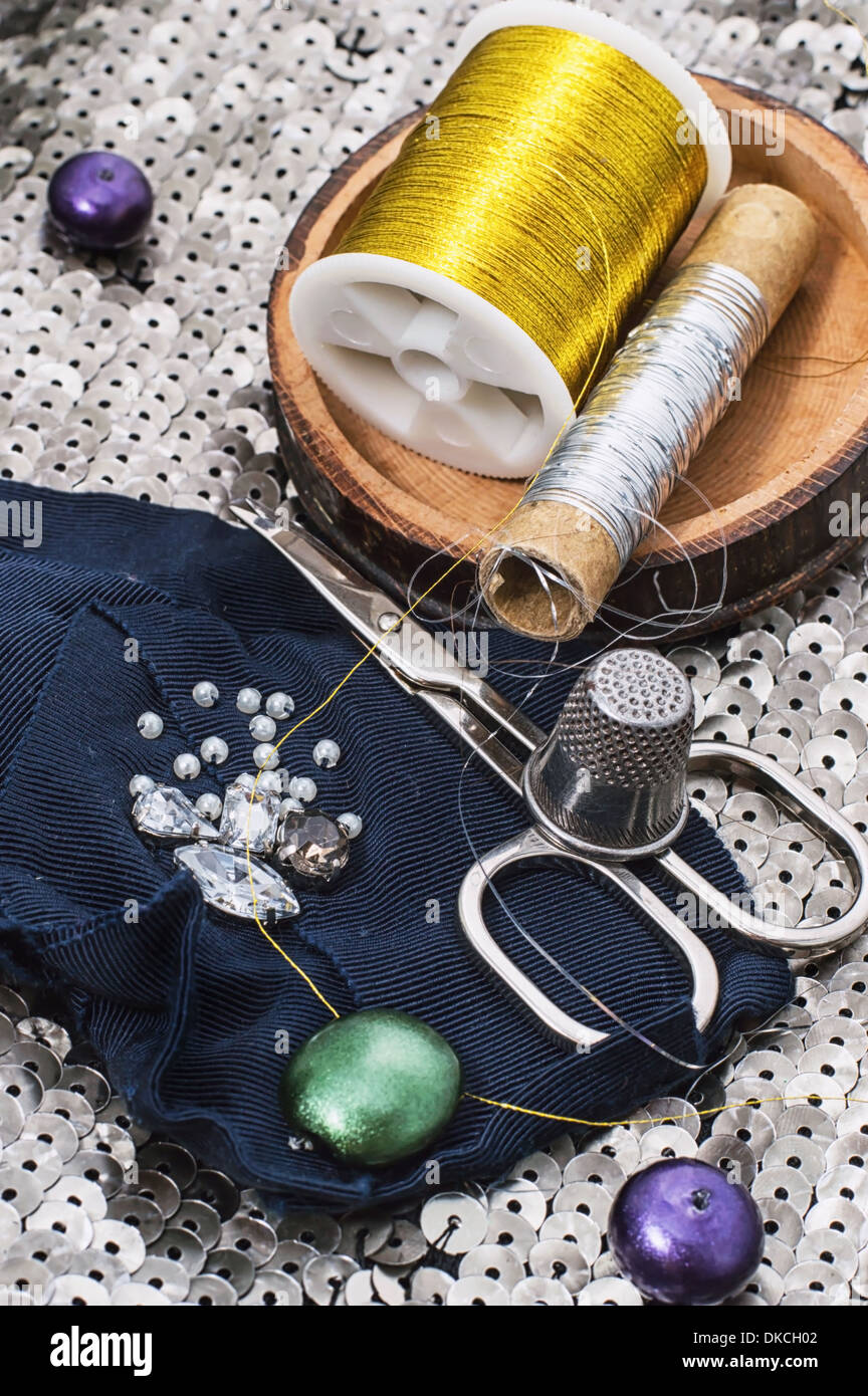 button and sewing tool Stock Photo - Alamy