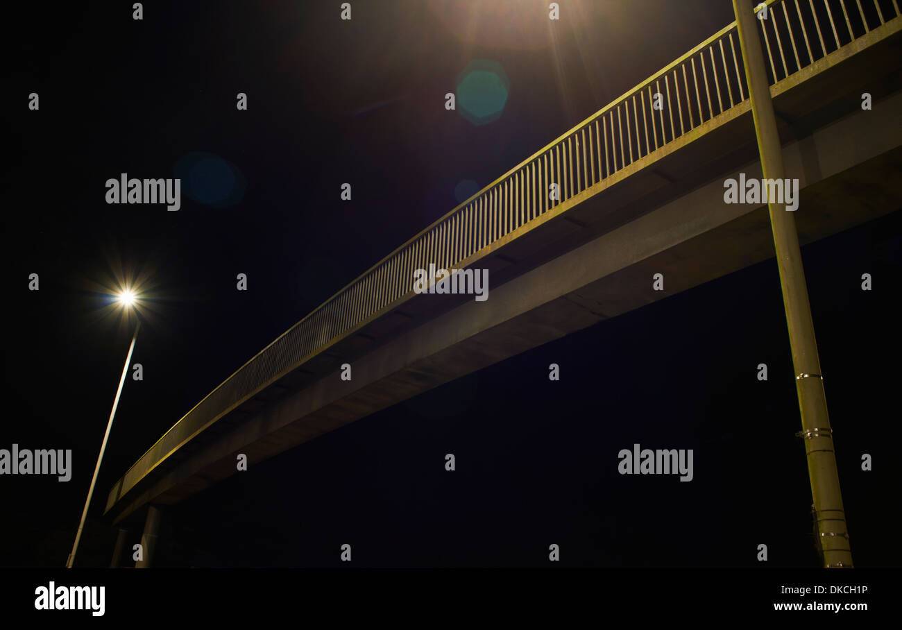Pedestrian footbridge at night Stock Photo - Alamy