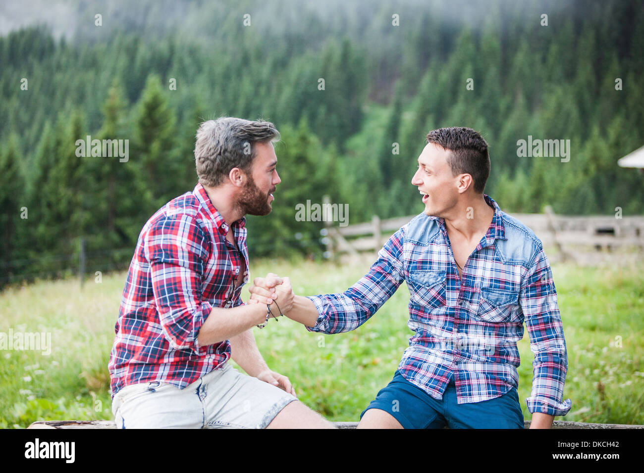 Two male friends talking outdoors hi-res stock photography and images ...