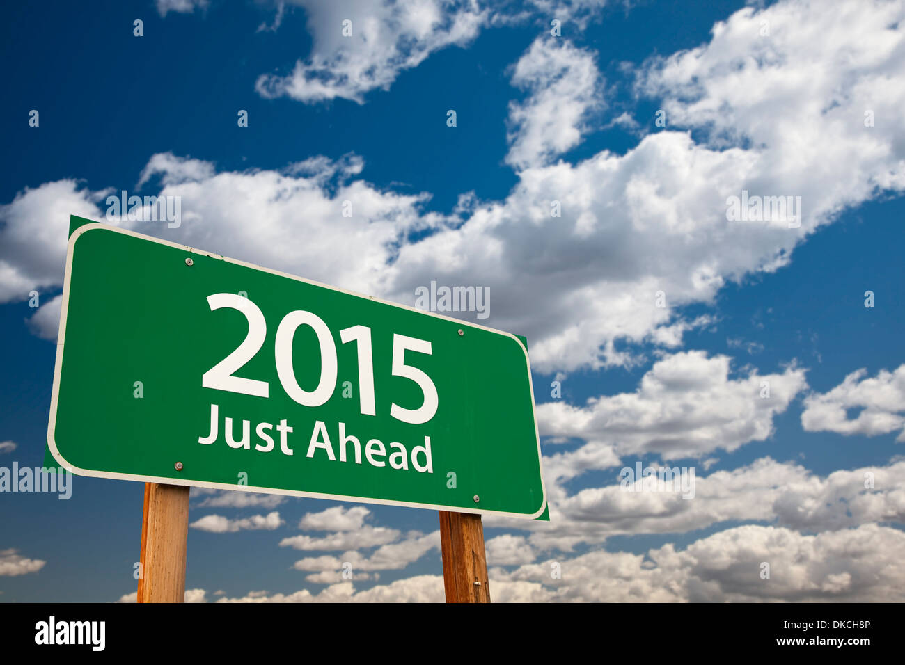 2015 Just Ahead Green Road Sign Over Dramatic Clouds and Sky Stock ...