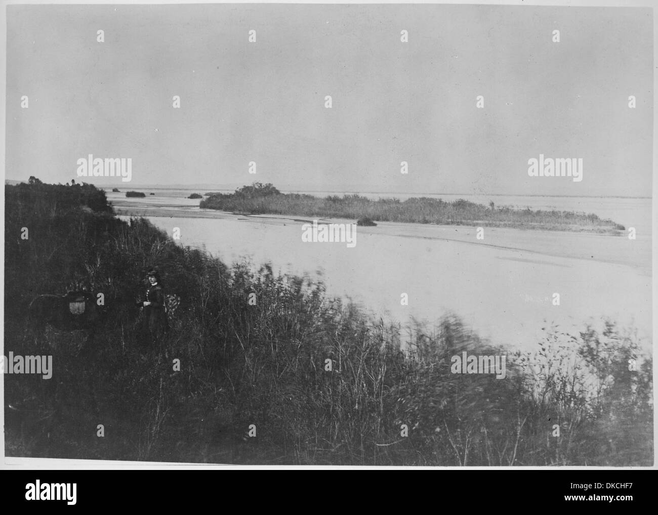 This photograph shows Mrs. W.H. Jackson near the Missouri River, with ...