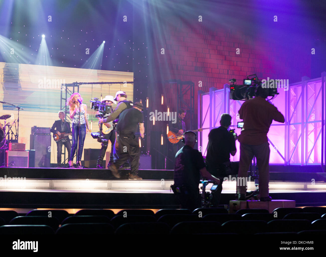 Film crews shoot footage during a musical performance on the set of the ...