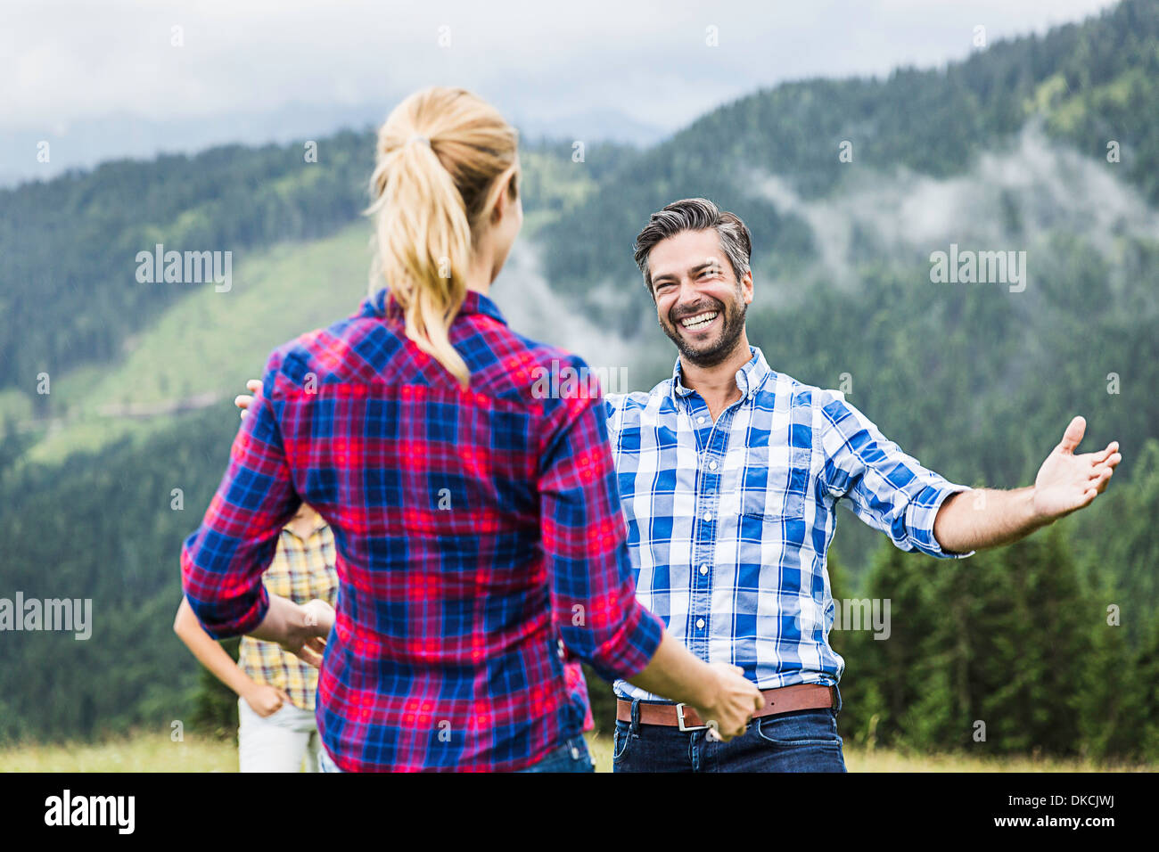 Greeting by arms hi-res stock photography and images - Alamy