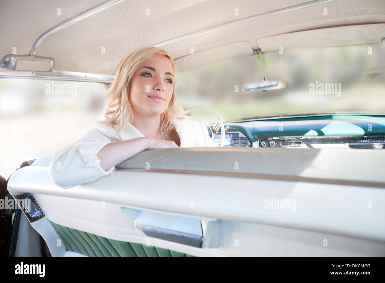 Sitting sideways hi-res stock photography and images - Alamy