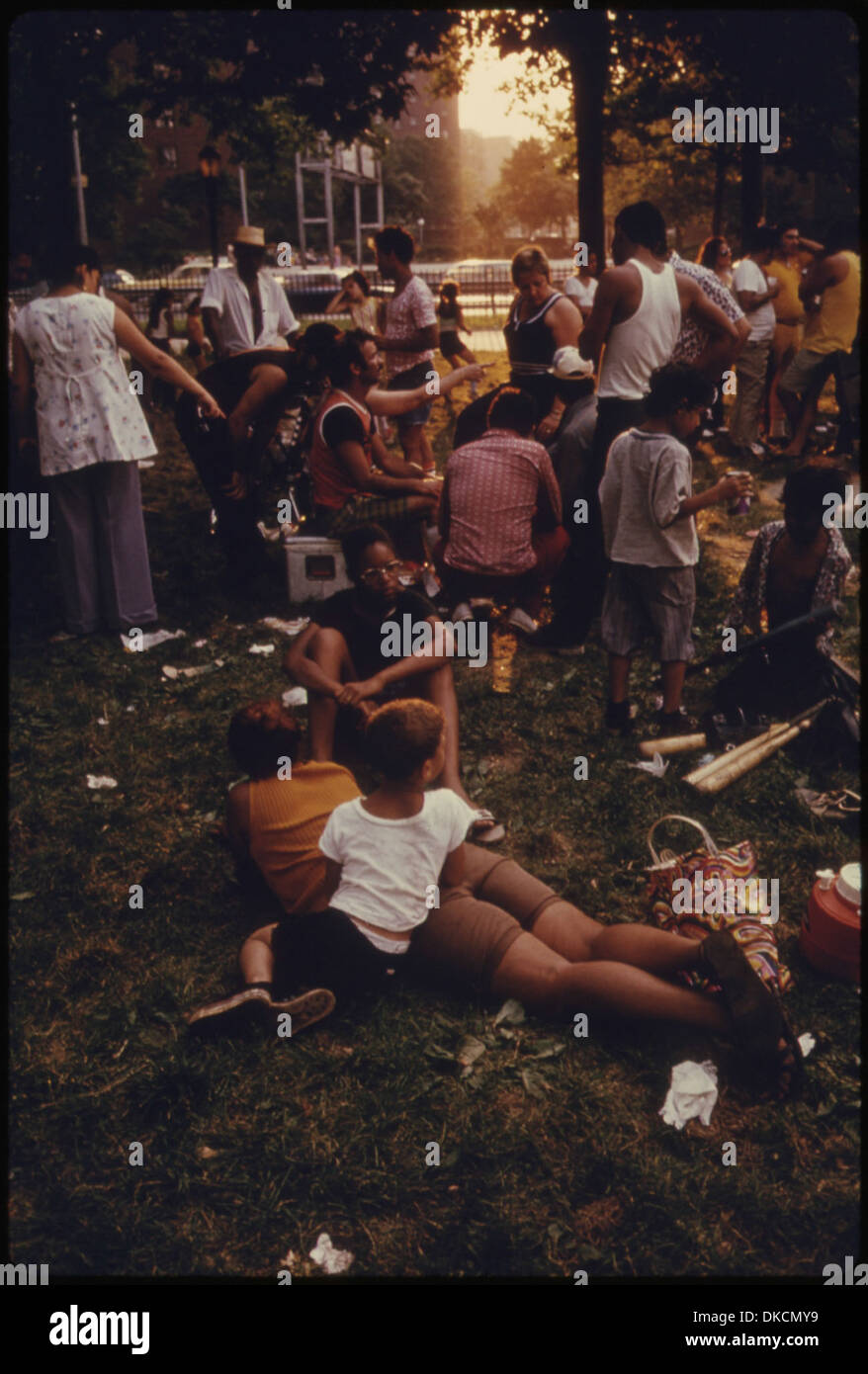 This image shows people relaxing in East River Park in Manhattan, New ...