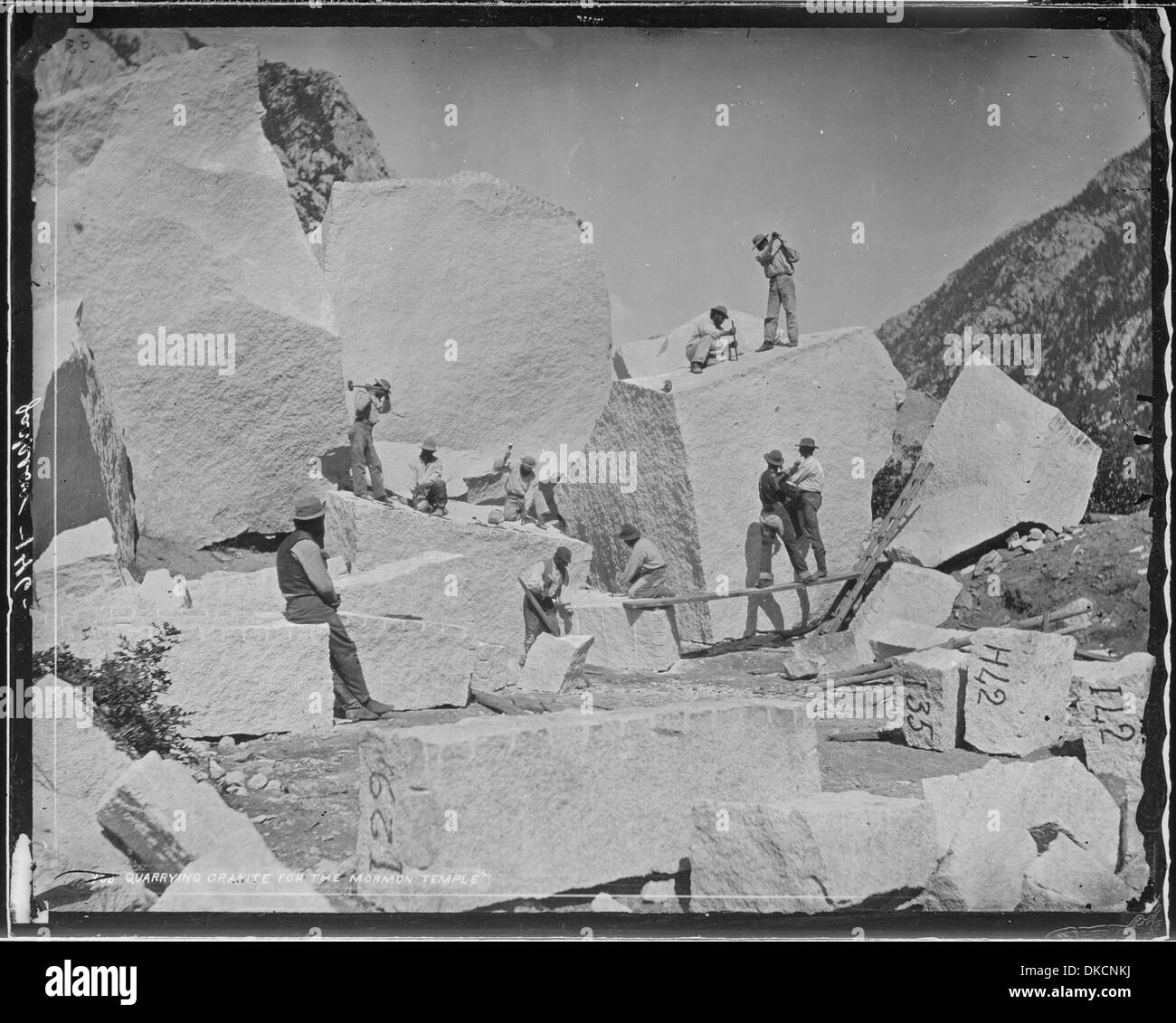 Workers are shown quarrying granite for the construction of the Mormon ...