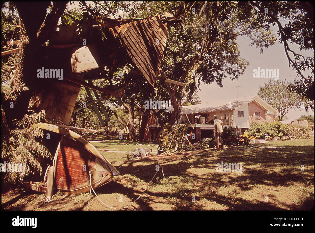 A photograph depicting the damage caused by river flooding, showing the ...