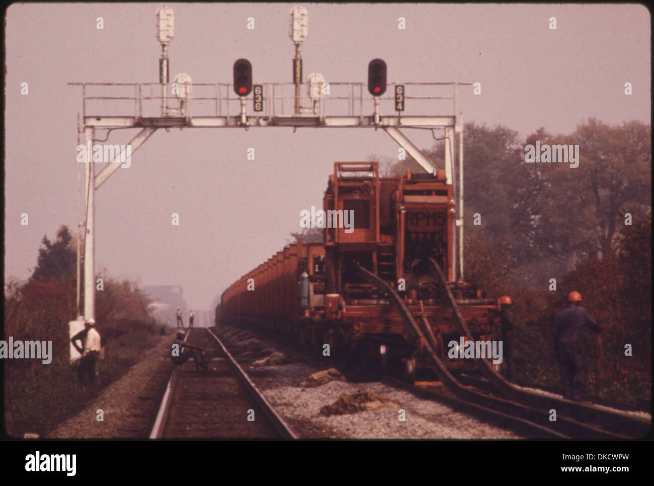 A Southern Railway work crew is seen with a specialized car designed to ...