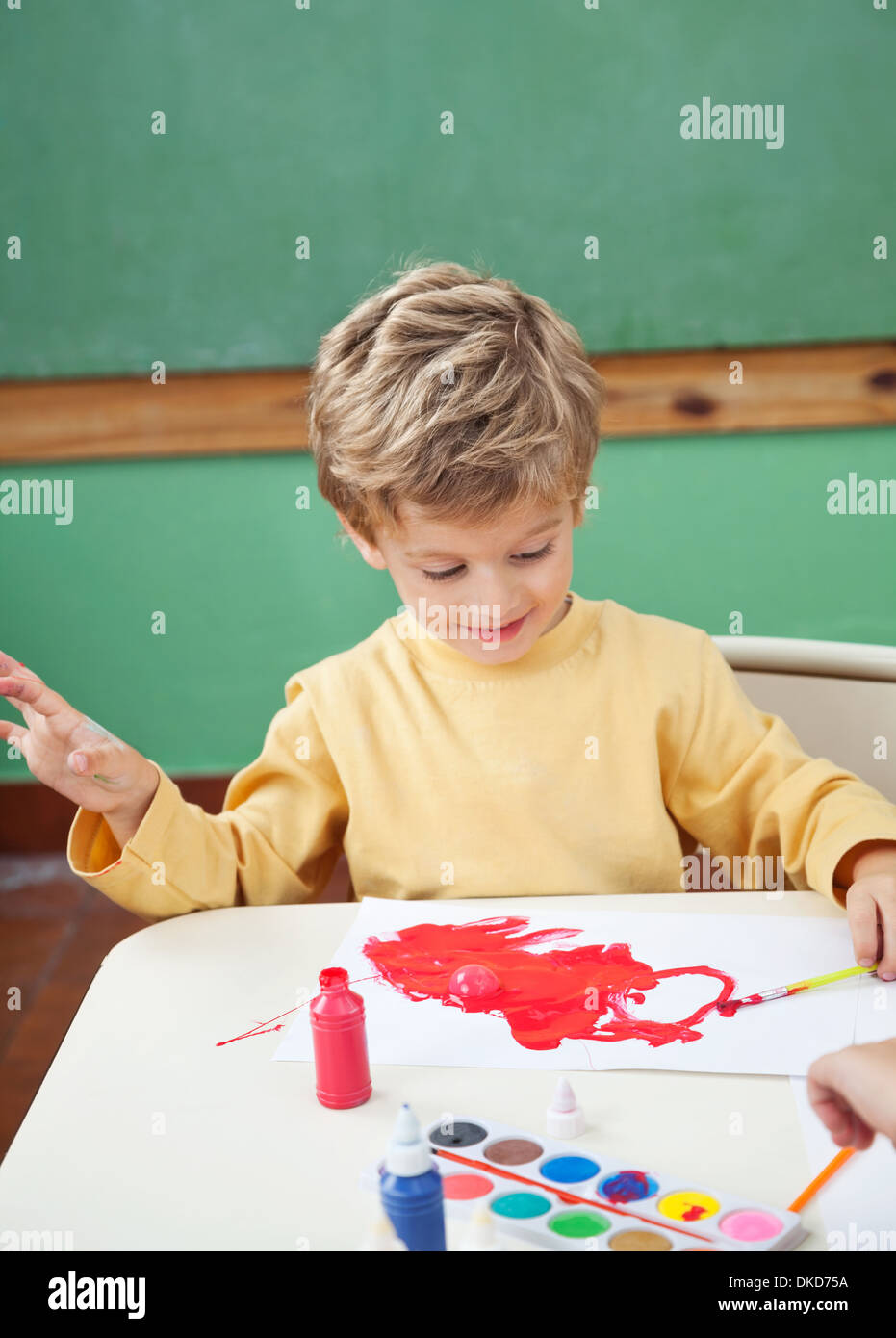 Boy Painting With Watercolors In Art Class Stock Photo - Alamy