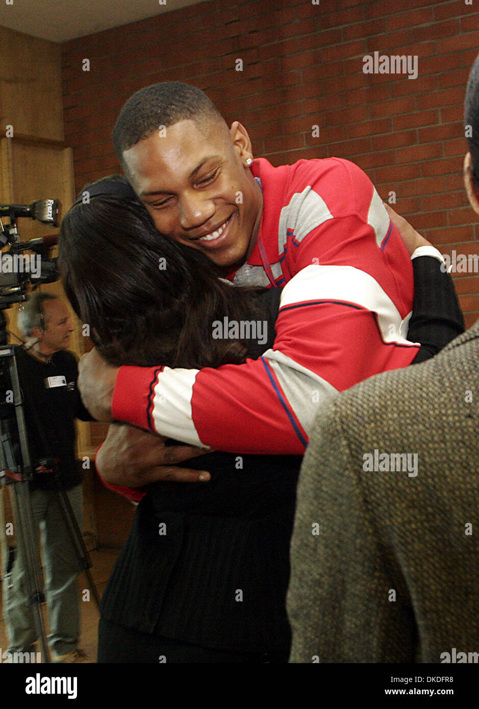 Jan 10, 2007; Richmond, CA, USA; ELIJAH HOLMAN hugs family friend ...