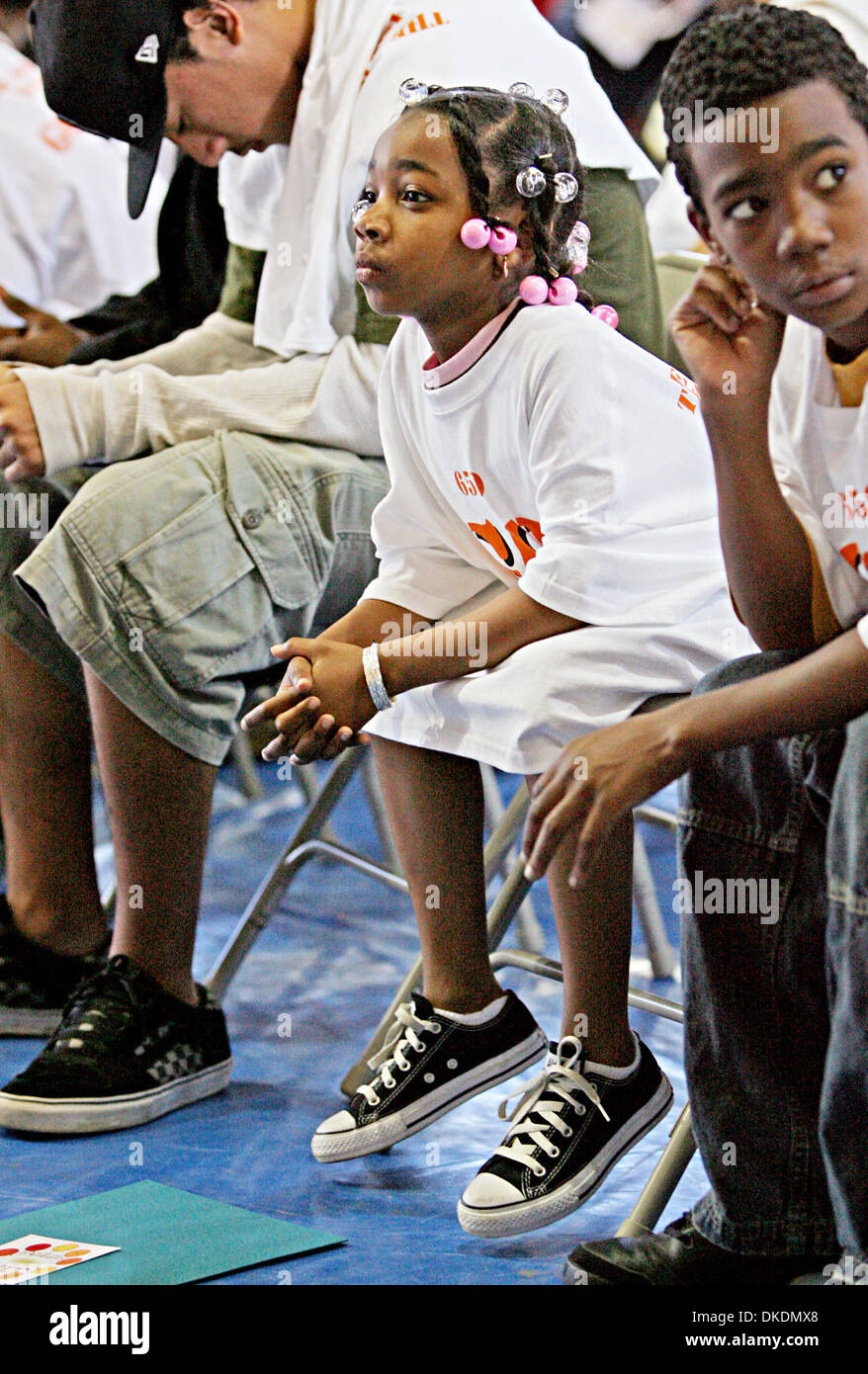 Camryn Williams(center),8,listens to a speaker at the Youth Summit in ...