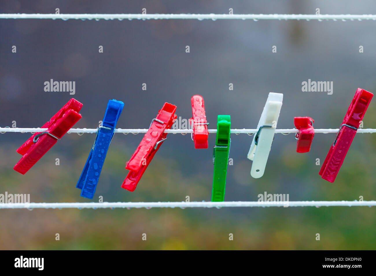 Colorful clips for washing laundry on strip rope outdoor. Background ...
