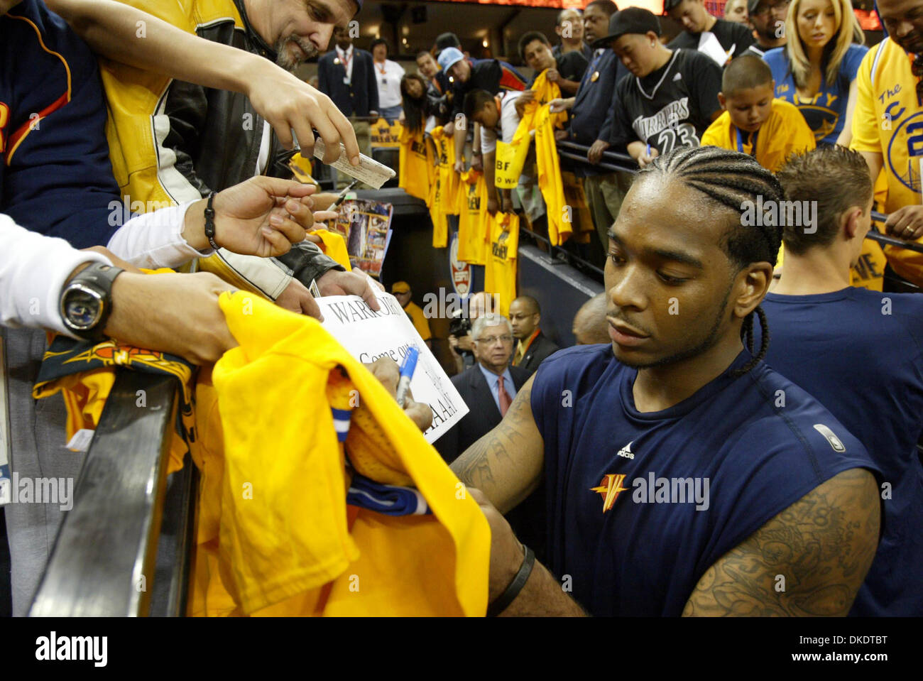 Golden State Warriors' Josh Powell, center, autographs memorabila to ...