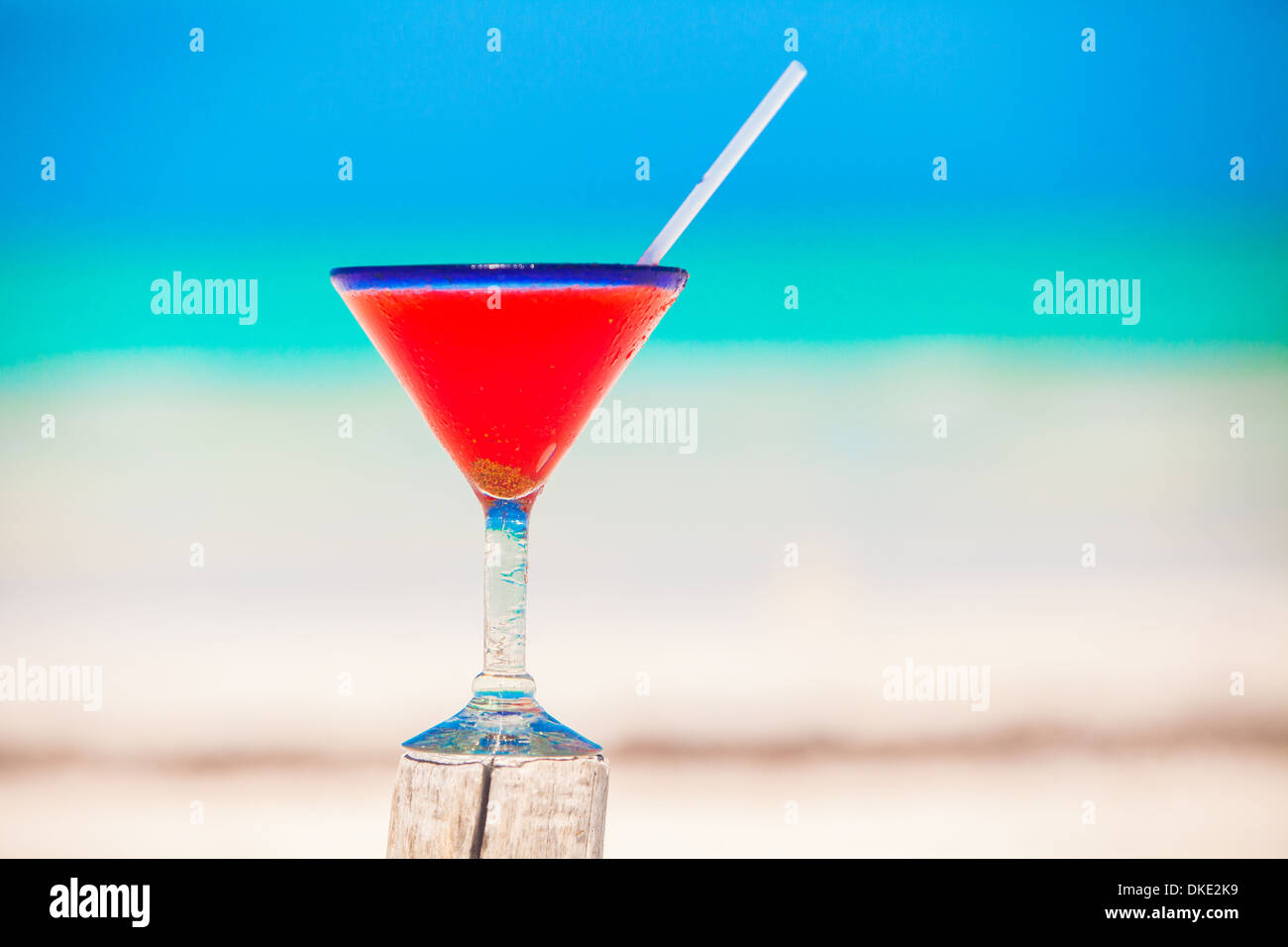 Strawberry margarita on the sandy white beach Stock Photo - Alamy