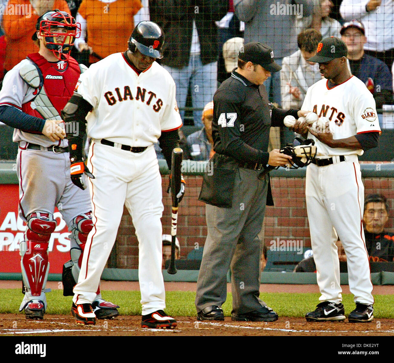 Home plate umpire Mark Wegner (47) gets specially marked baseballs from ...